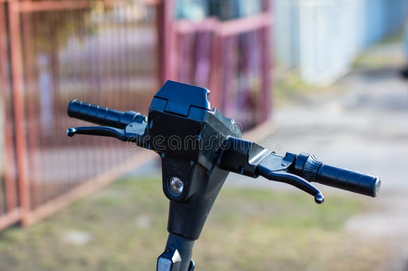 A Detailed Close Up View of the Handlebars of an Electric Scooter Stock ...
