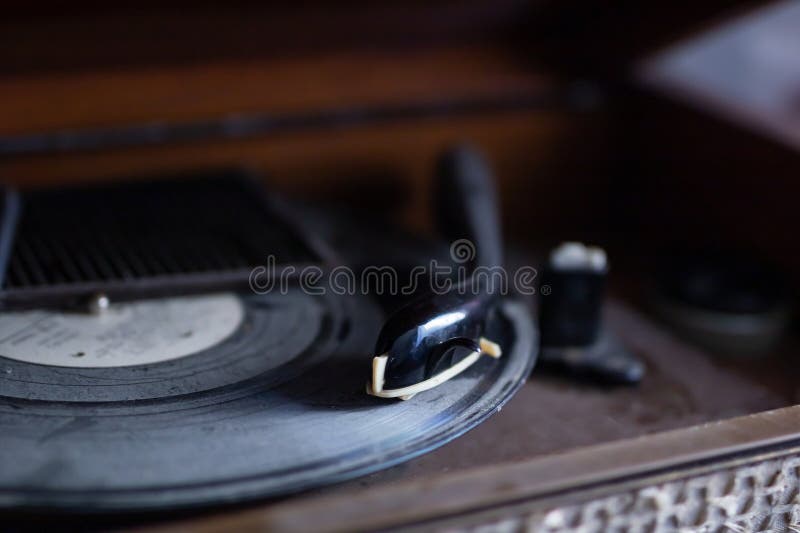 A Detailed Closeup of a Record Player Featuring a Vinyl Record on it ...