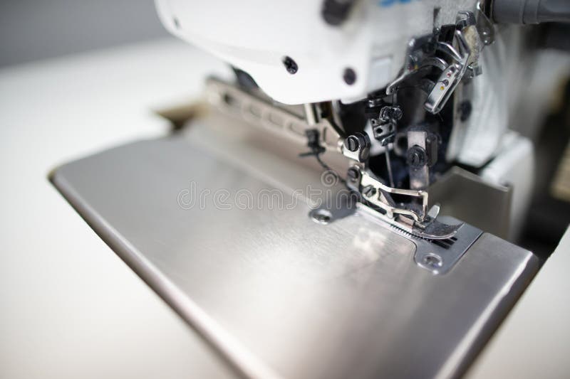 A Detailed Closeup View of a Sewing Machine Needle Combined with the ...