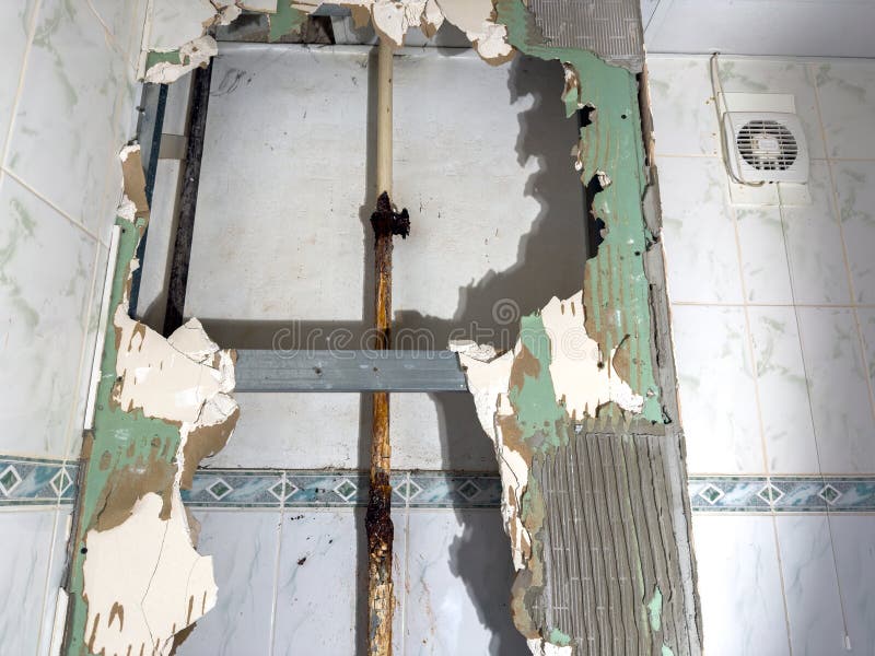 The Wall Has Damage, with an Exposed Rusty Water Pipe and Crumbling ...