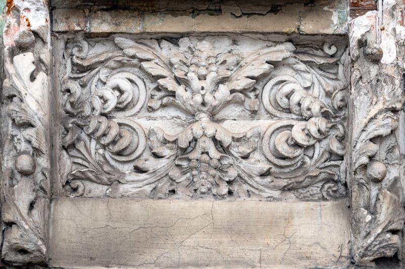 A Detailed Decorative Relief Carving on a Wall, Intricate Floral and ...
