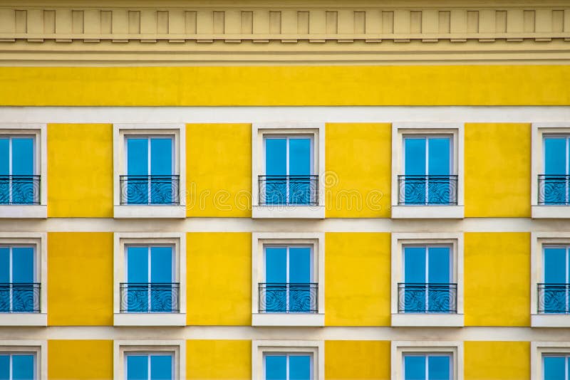 Detailed Front View of a Facade with Windows with Balconies and Yellow ...