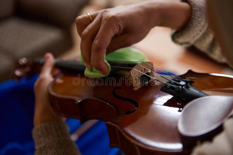 Close-up of Hands Cleaning a Violin with a Cloth Indoors Stock Image ...