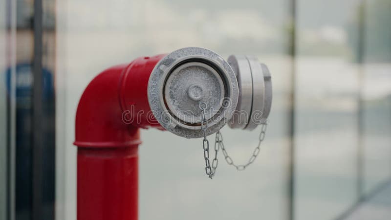 Close-Up of a Red Fire Hydrant with Dust Cap and Chain in Urban Setting ...