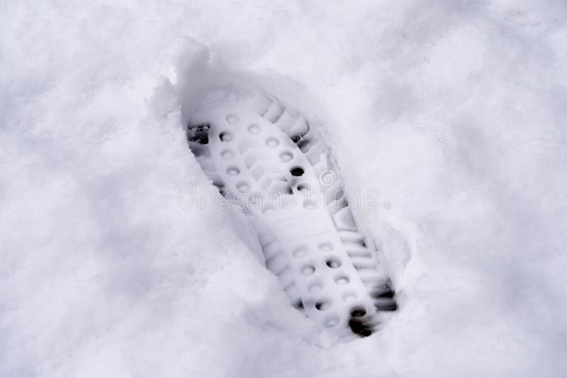 A Detailed Imprint of a Single Boot Print in Fresh Snow Stock Image ...