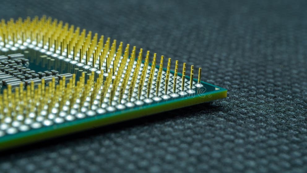 Close-Up View of a Computer Processor Unit on a Dark Textured Surface ...