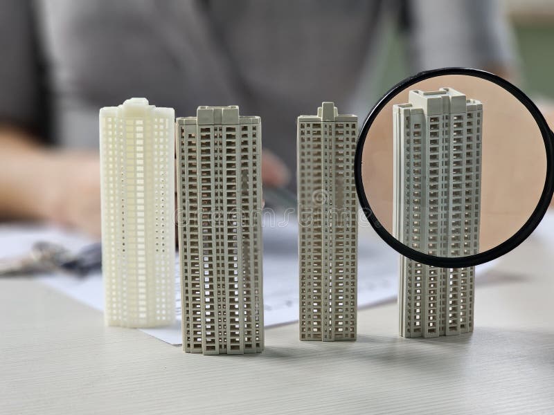 Detailed Miniature Building Models Showcased on a Workspace during a ...