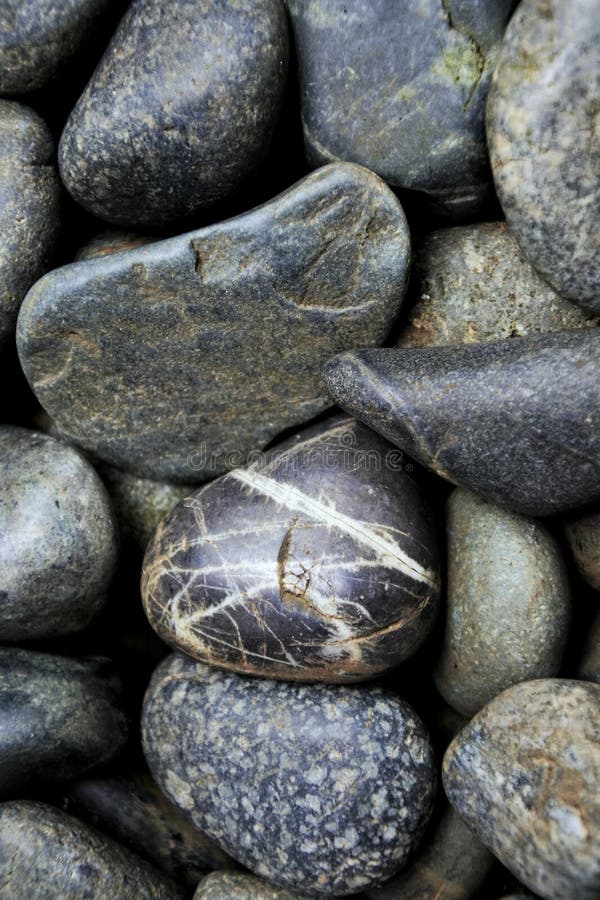 A Detailed Pile of River Stones with Different Patterns is Visible ...