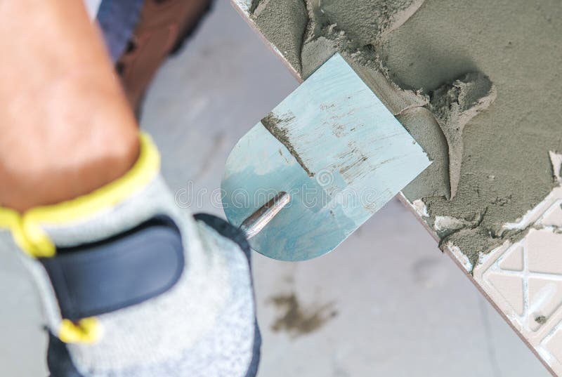 Detailed Tiling Work in a Construction Site Using a Trowel Stock Photo ...