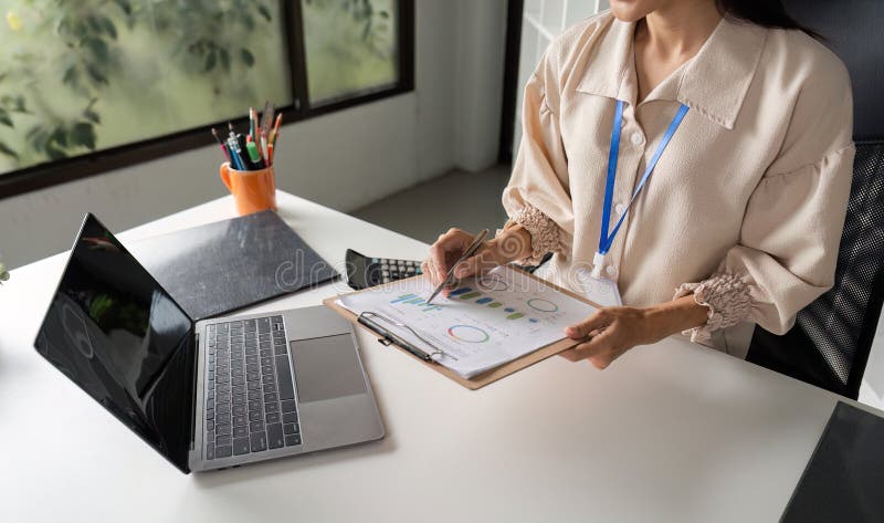 Close-up of Accountant Analyzing Financial Documents with Charts and ...