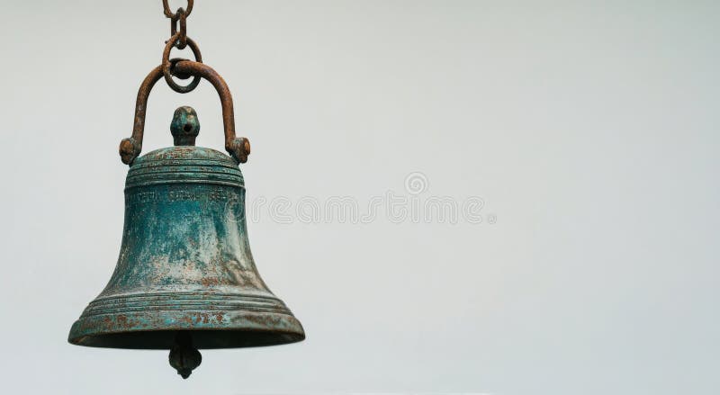 A Detailed View of an Antique Bell with a Worn Finish Showcasing ...