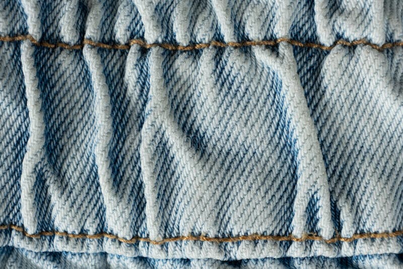 Detailed View of Blue Jeans Fabric and Yellow Thread Stitching Stock ...