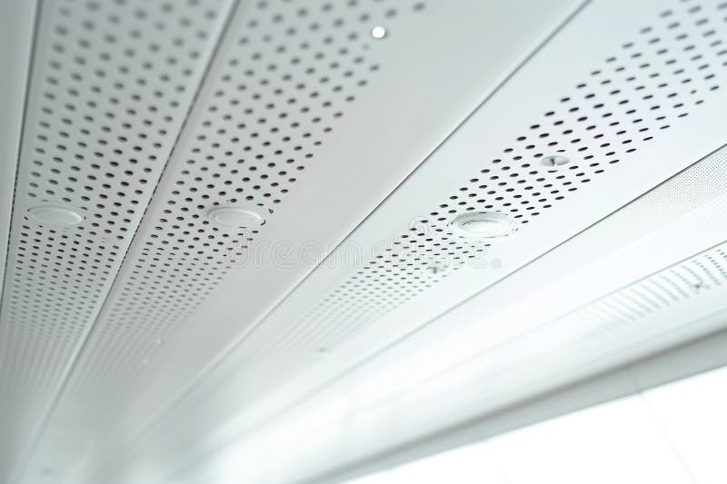 A Detailed View of a Ceiling with Multiple Holes. this Image Can Be ...