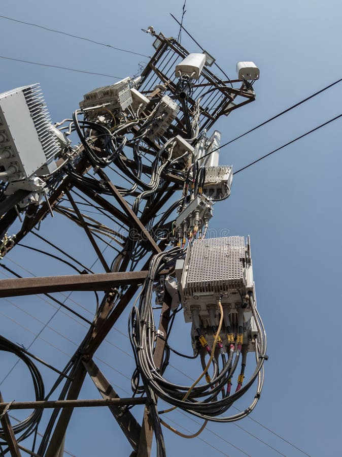 Cluttered Utility Pole with Assortment of Electronic Equipment, Including Multiple Antennas ...
