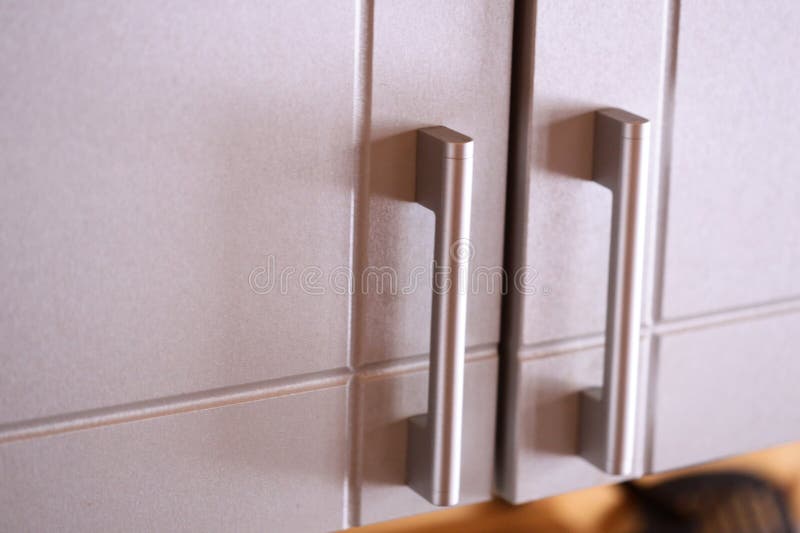 A Detailed View of a Door Handle on a Kitchen Cabinet Stock Photo ...