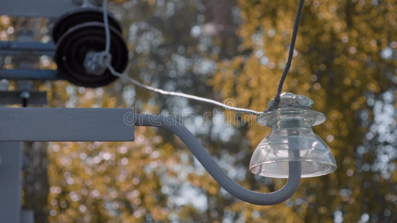 Video 4k. Close-up of an Insulator on a Power Line Against a Natural ...