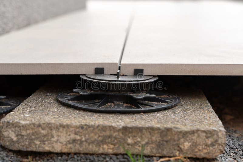 Detailed View of an Elevated Tile Installation Using Plastic Pedestals ...