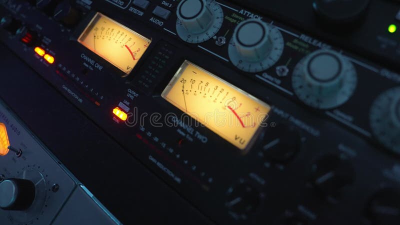 A Detailed View of Faders and Control Knobs on an Audio Mixing Console ...