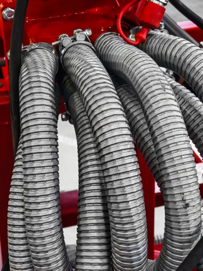 Detailed View of Flexible Hoses Connected To Industrial Equipment in a ...