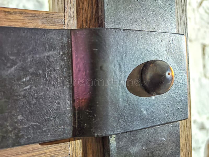 Detailed View of Hand Forged Iron Strap Hinge and Round Rivet. Close-up ...