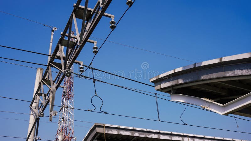 A Detailed View of an Industrial Overhead Wire Structure Set Against a ...