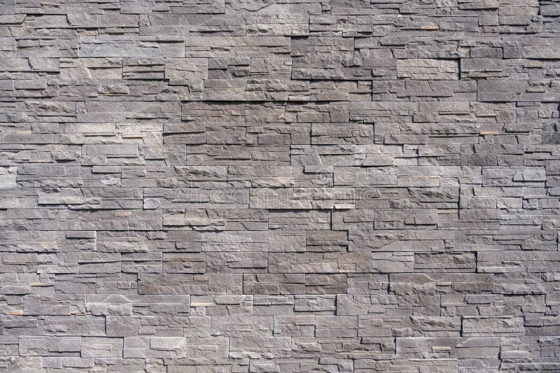 A Detailed View of a Modern Gray Stone Wall with Rectangular Patterns ...