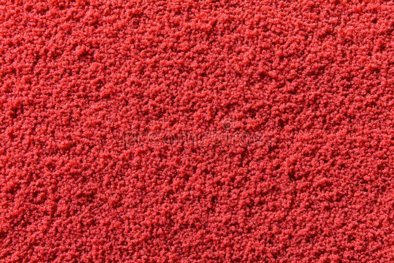 A Detailed View of a Red Carpet Featuring Numerous Small Holes ...