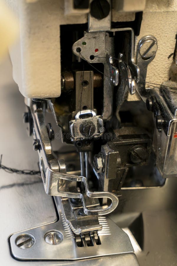 Detailed View of a Sewing Machine in Action at a Textile Workshop Stock ...