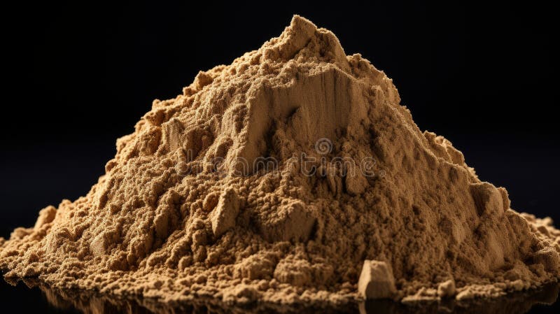 A Detailed View of a Small Mound of Fine Brown Powder Against a Dark ...