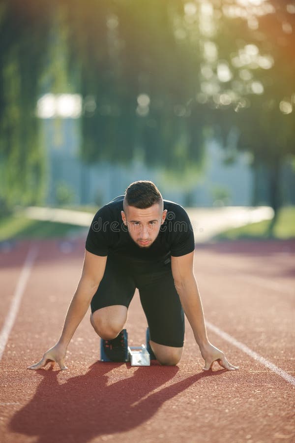 Detailed View of a Sprinter Getting Ready To Start. Selective Focus ...