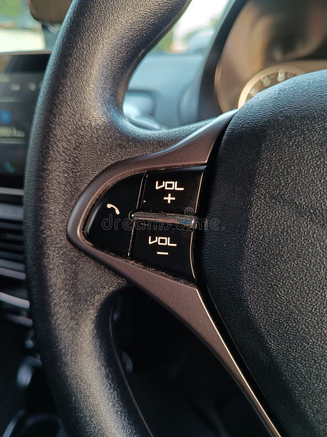 Close-Up of Steering Wheel Controls for Volume Adjustment in Modern ...