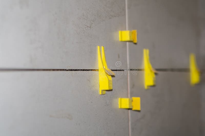 Detailed View of Tile Leveling System in Use with Plastic Clips and ...