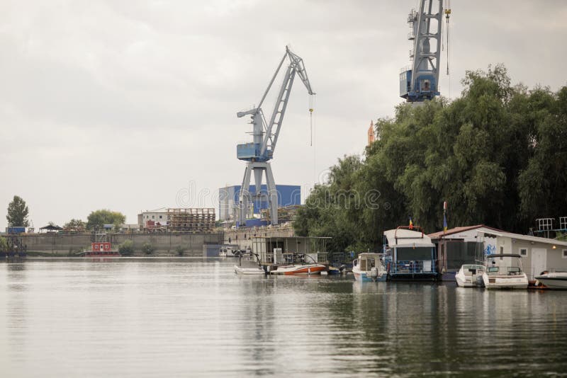 Details with Cranes and Ships in the Shipyard and on the Docks of ...