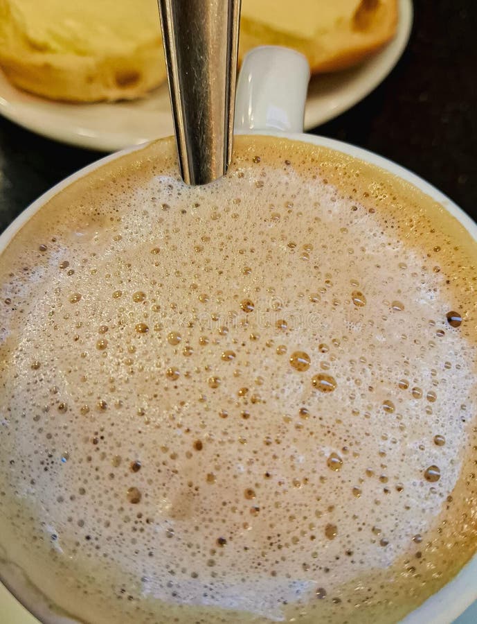Details of a frothy latte. stock photo. Image of coffee - 336750824