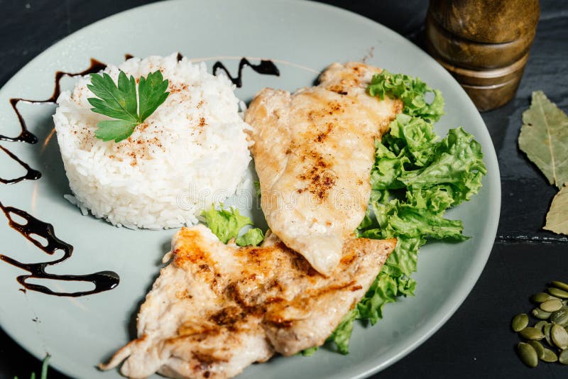 Details of Grilled Chicken Breast with Risotto and Parsley Stock Photo ...