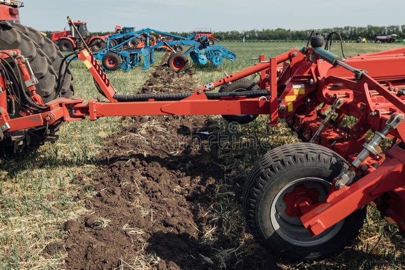 Details of a Large Red Plow Tractor Trailer for Tillage in Summer Stock ...
