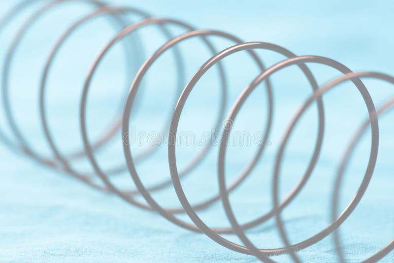Details of a Metal Spring on Blue Cloth Stock Image - Image of object ...