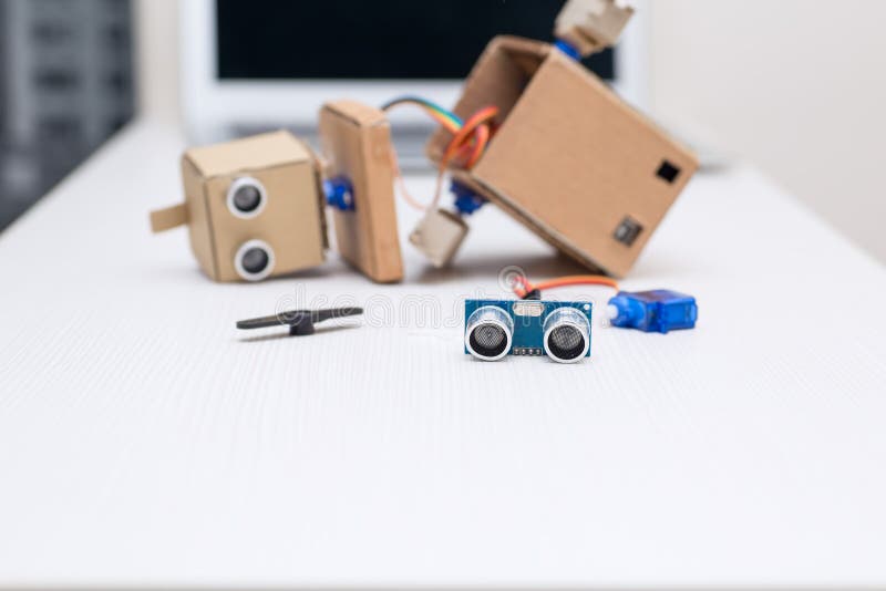 Details for Robot on a White Table at Home Stock Image - Image of ...