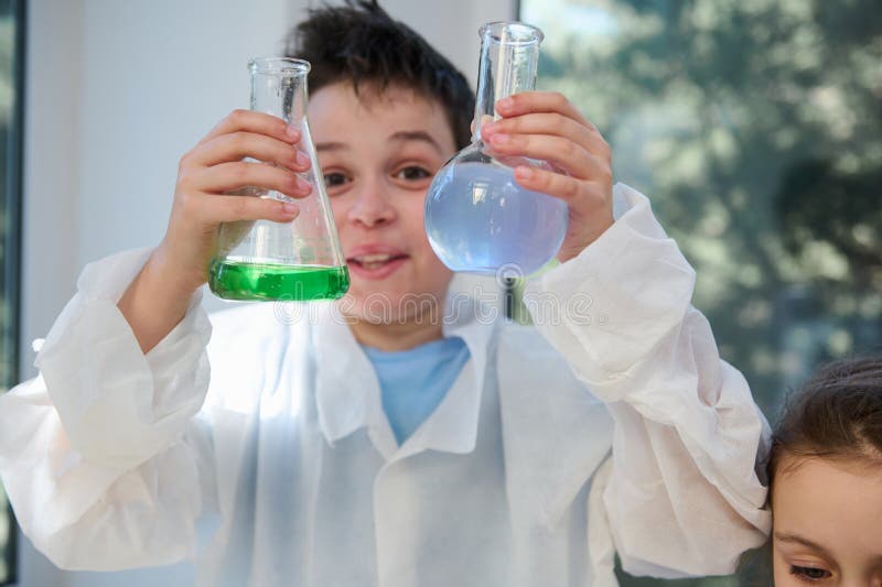 Details Schoolboy S Hands, Hold Lab Flasks with Chemical Solutions ...
