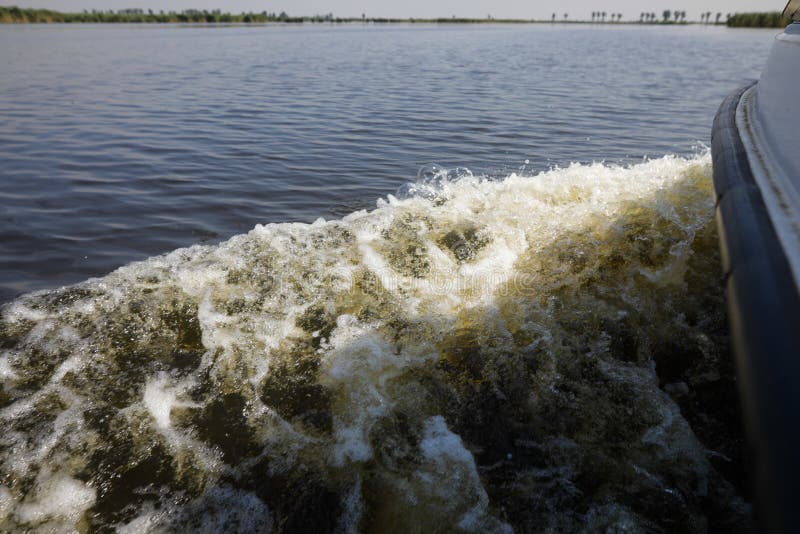 Details with the Surf Created by a Moving Small Boat on a Lake Stock ...