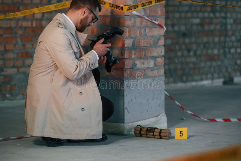 Detective in Coat is on the Crime Scene with Explosive Bomb Stock Photo ...