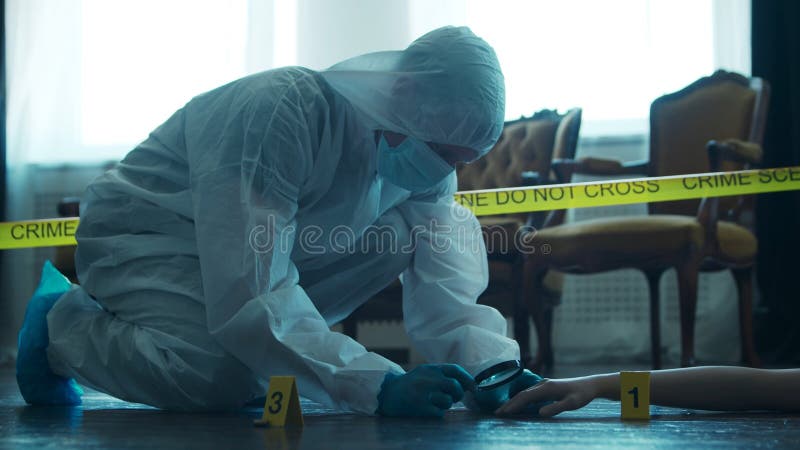 Detective Collecting Evidence In A Crime Scene Forensic Specialists