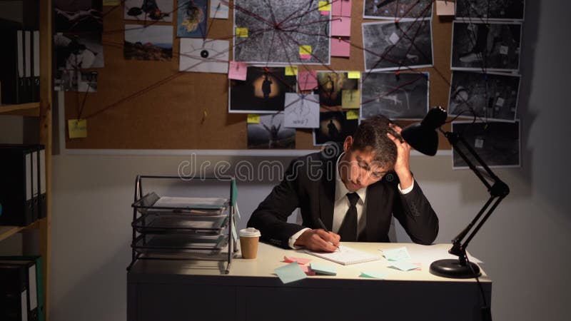 Detective with Headache Working in His Office Stressed from Problems ...