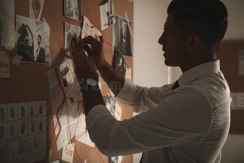 Detective Looking at Evidence Board in Office Stock Image - Image of ...