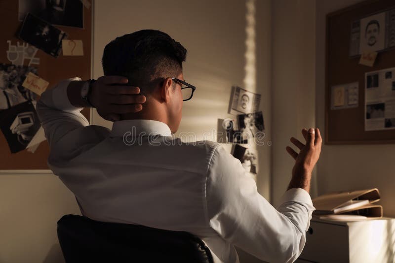 Detective Looking at Evidence Board in Office Stock Image - Image of ...