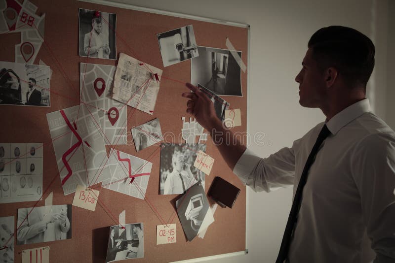 Detective Looking at Evidence Board in Office Stock Image - Image of ...