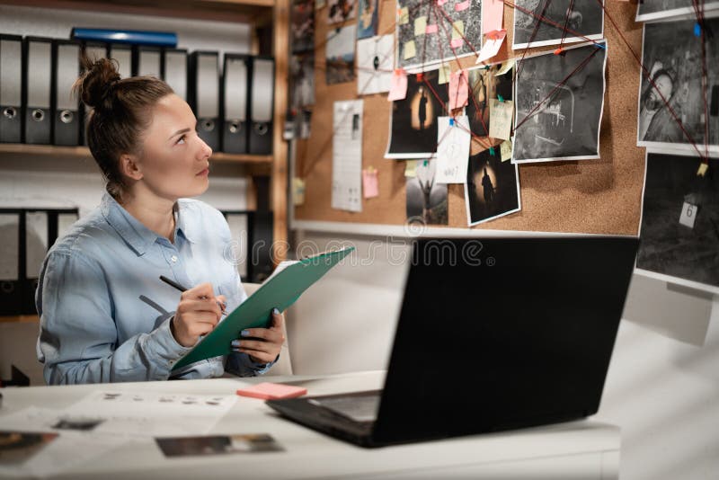 Detective Looking at Evidence Board in Office, Stock Photo - Image of ...