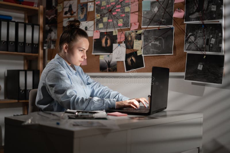 Detective Processing Evidence in Office Using Laptop Computer Stock ...