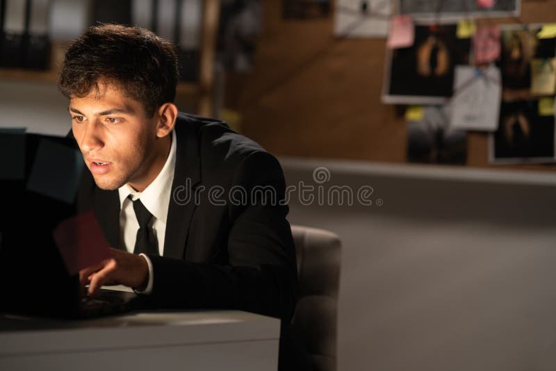 Detective Processing Evidence in Office, Working at Desk Stock Photo ...