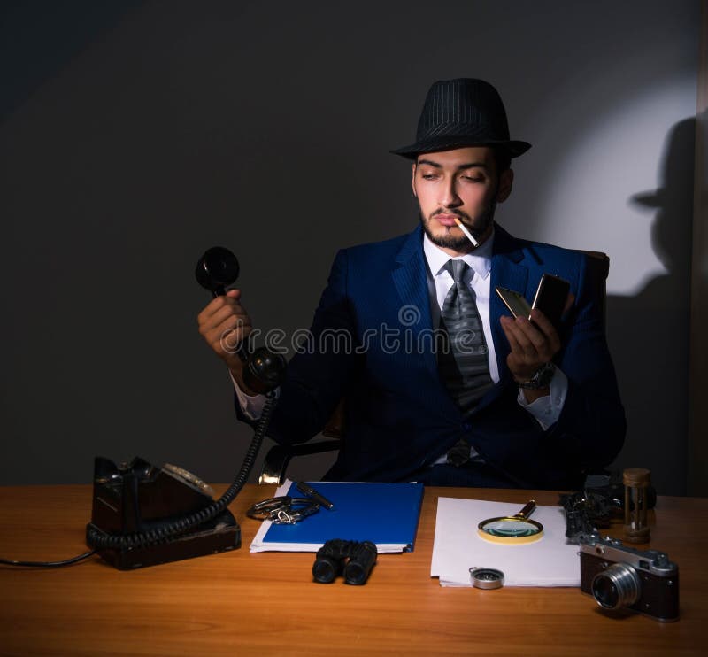 Detective Sitting in Dark Room in Vintage Concept Stock Photo - Image ...